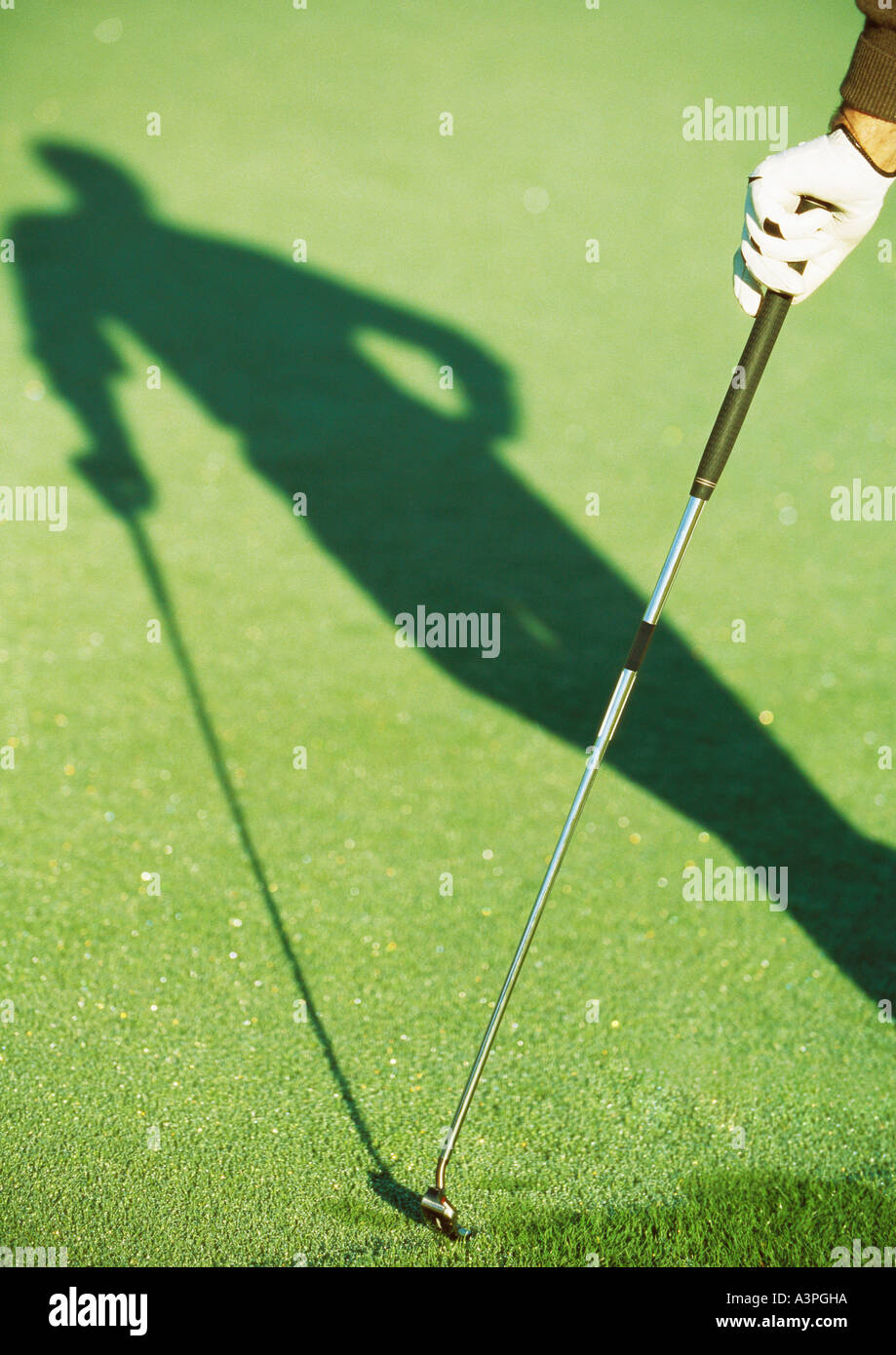 Shadow of golfer Stock Photo - Alamy