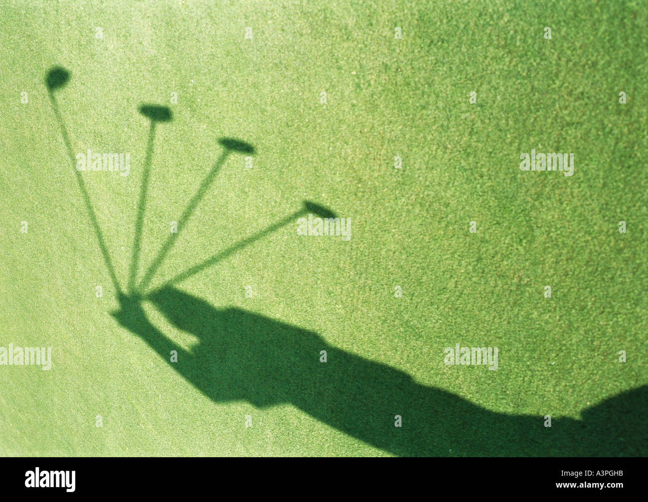 Shadow of golfer swinging, motion study Stock Photo - Alamy
