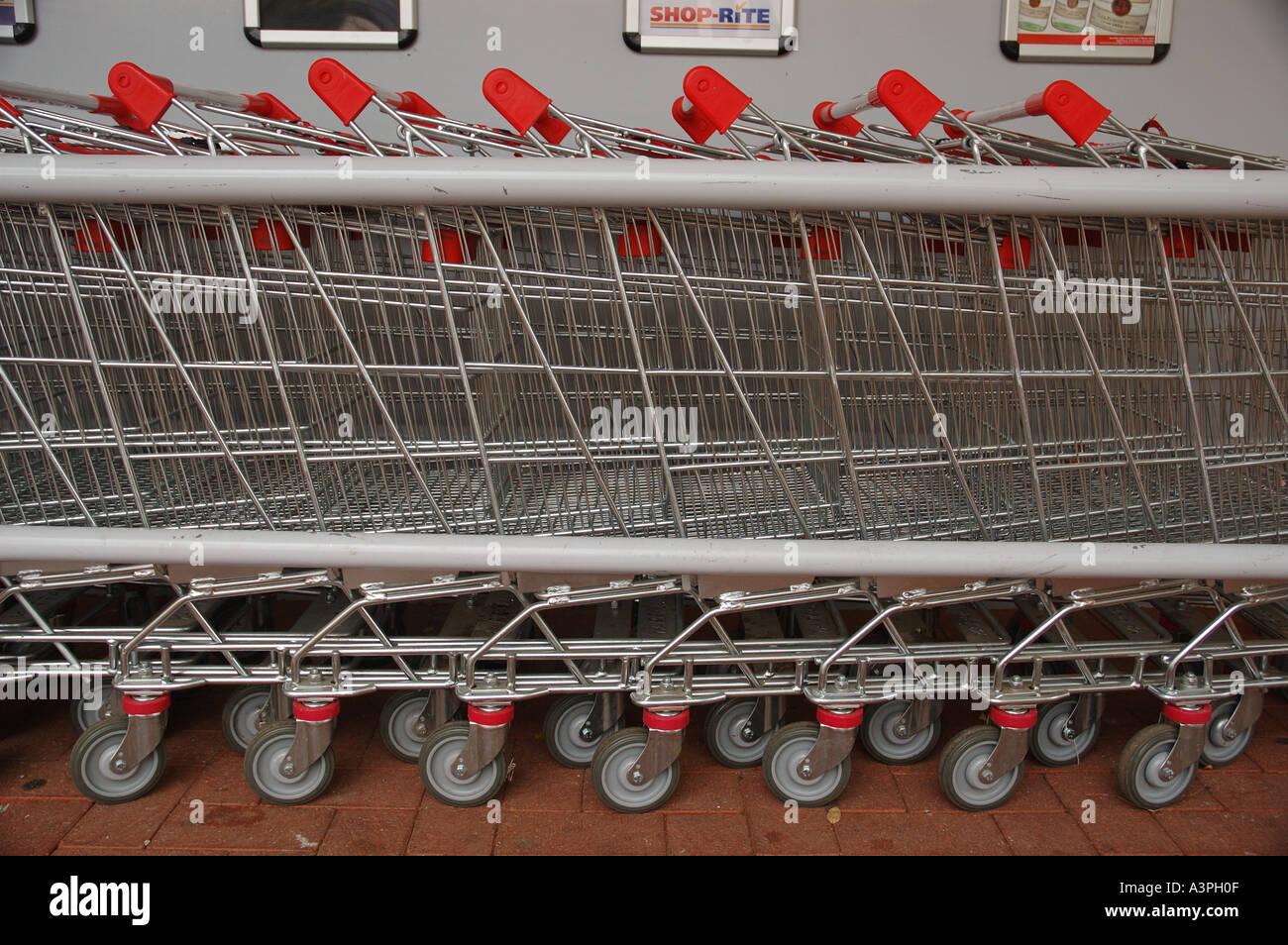 line of shopping trollies at supermarket Stock Photo - Alamy