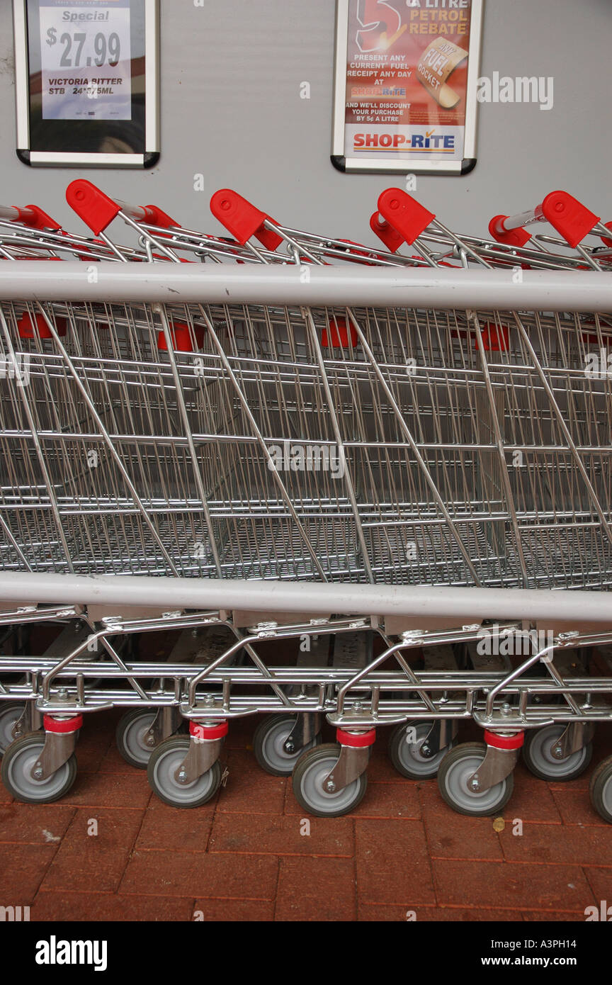 line of shopping trollies at supermarket Stock Photo - Alamy