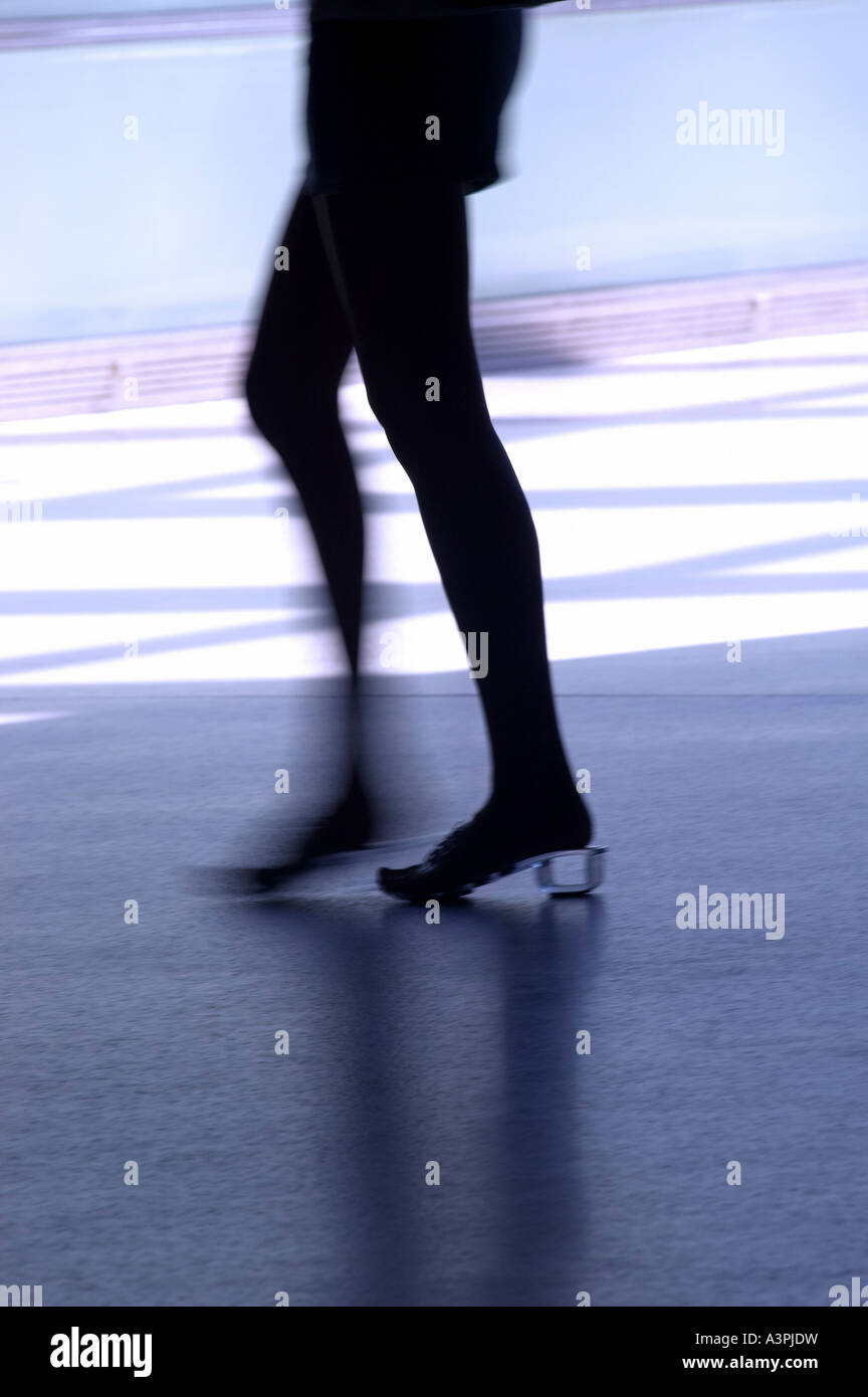 Legs of a walking woman Stock Photo - Alamy