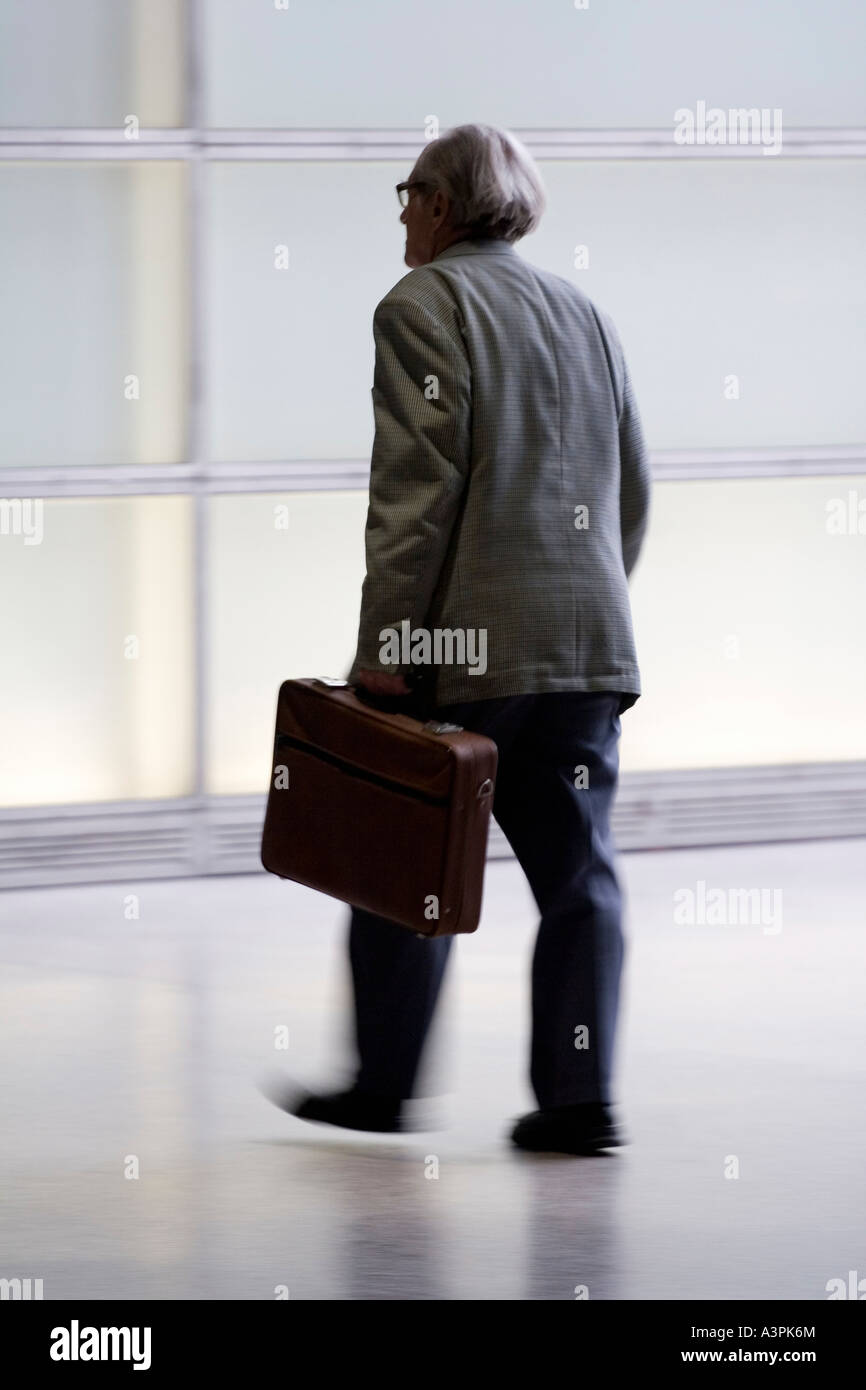 An elderly man with suitcase Stock Photo - Alamy