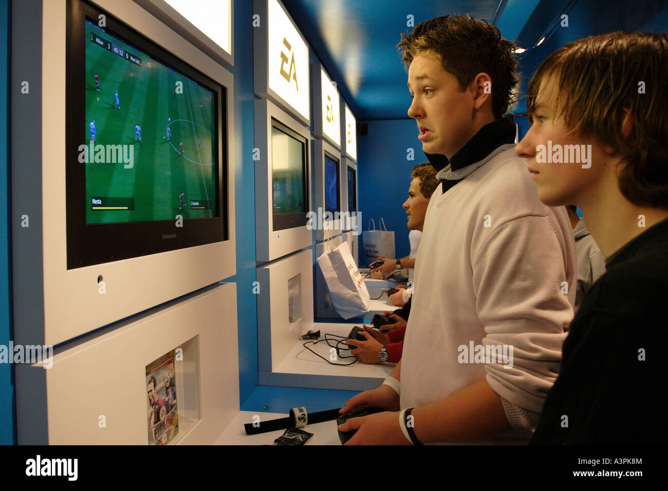 Teenage boys playing computer games at the Youth Fair YOU, Berlin ...