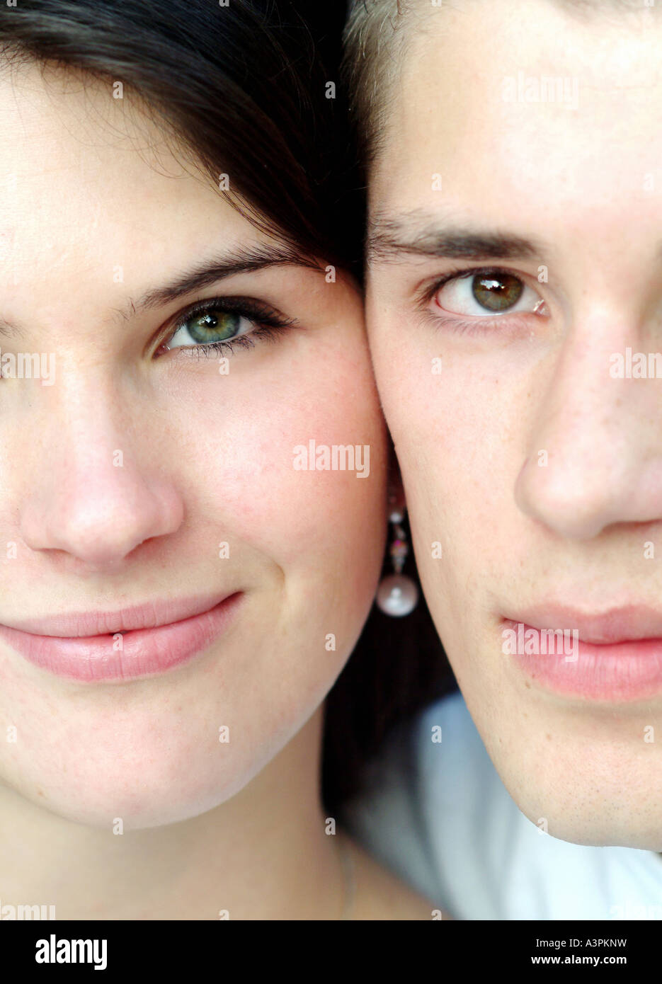 Faces of young couple close to each other Stock Photo - Alamy
