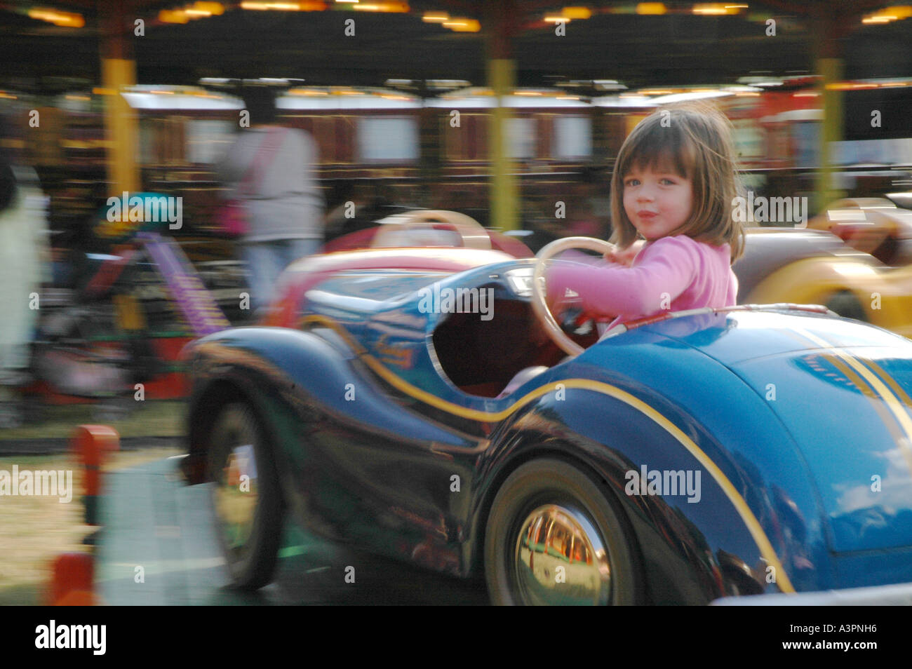 Girl riding a car Stock Photo - Alamy