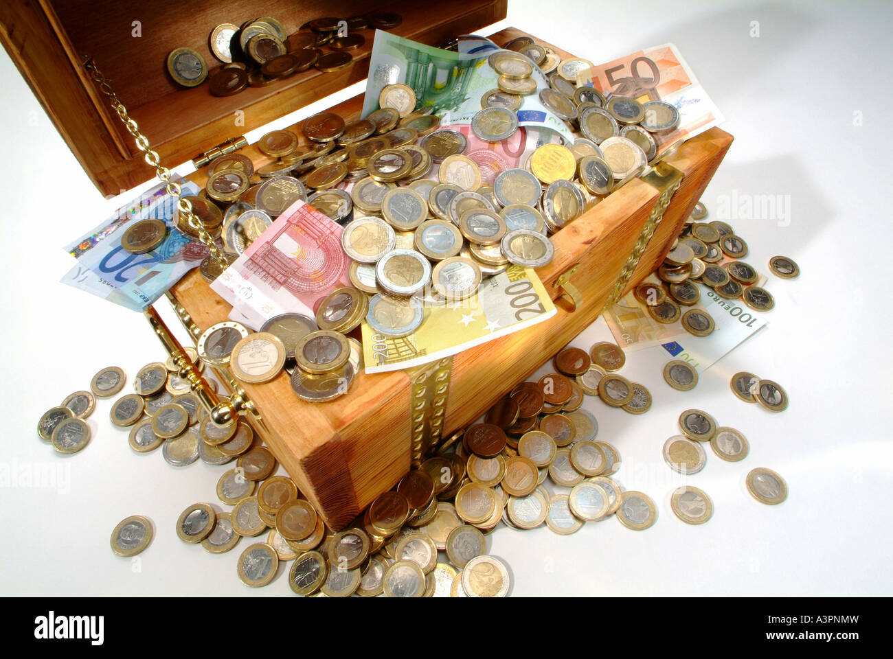 A treasure chest filled with money Stock Photo - Alamy