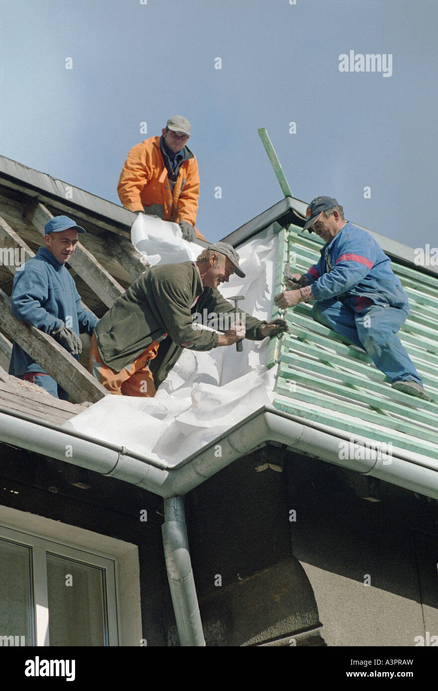 Roofers at work, Poznan, Poland Stock Photo - Alamy