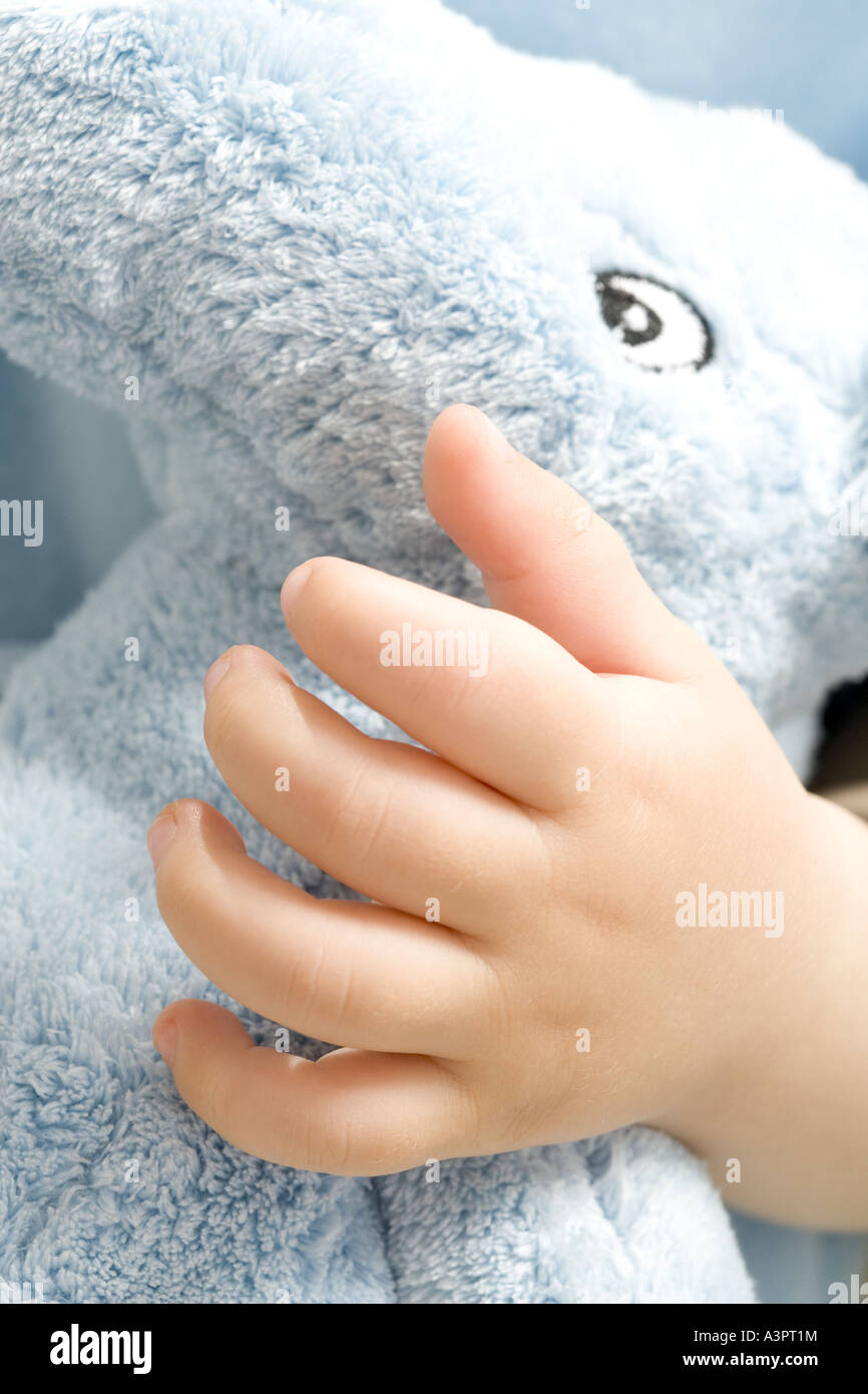 baby hand and toy Stock Photo - Alamy