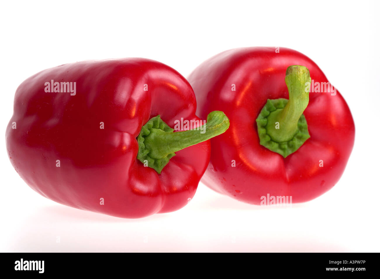 red peppers white background capsicum bell pepper Stock Photo - Alamy
