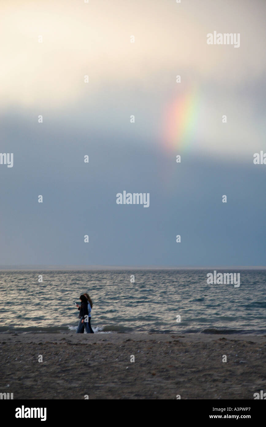 People walk along rainbow hi-res stock photography and images - Alamy