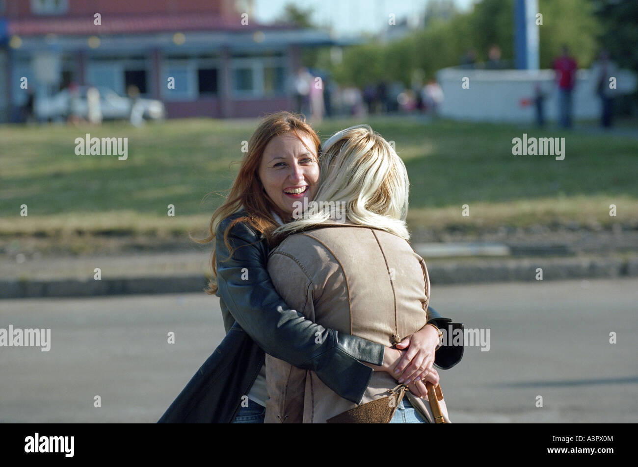 Two young women embracing, Kaliningrad, Russia Stock Photo - Alamy
