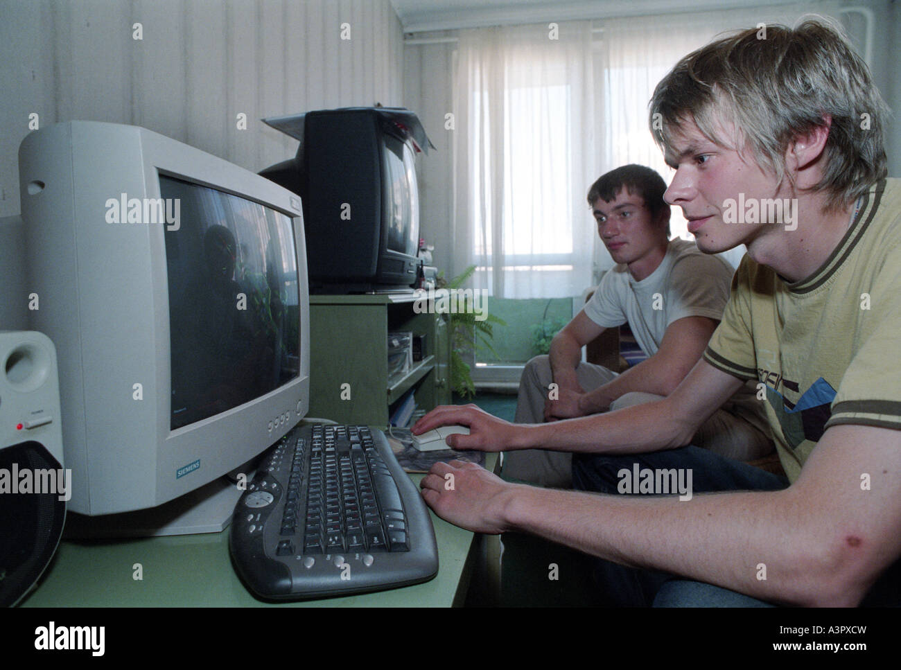 Teenagers playing a computer game, Kaliningrad, Russia Stock Photo - Alamy