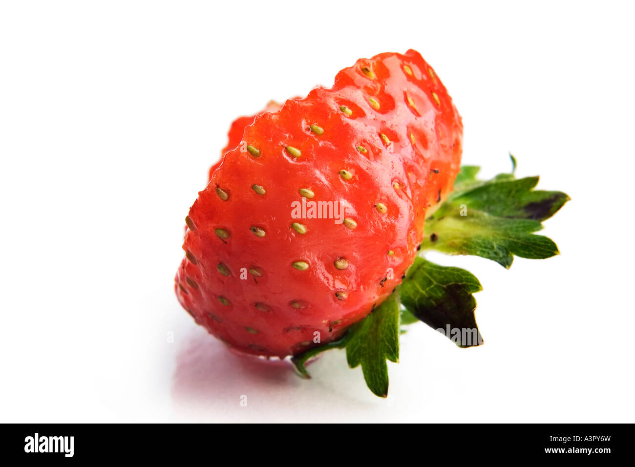 Strawberry with a bite out of it Stock Photo - Alamy