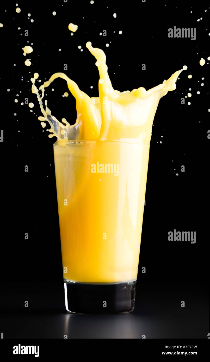Orange juice splash Stock Photo - Alamy
