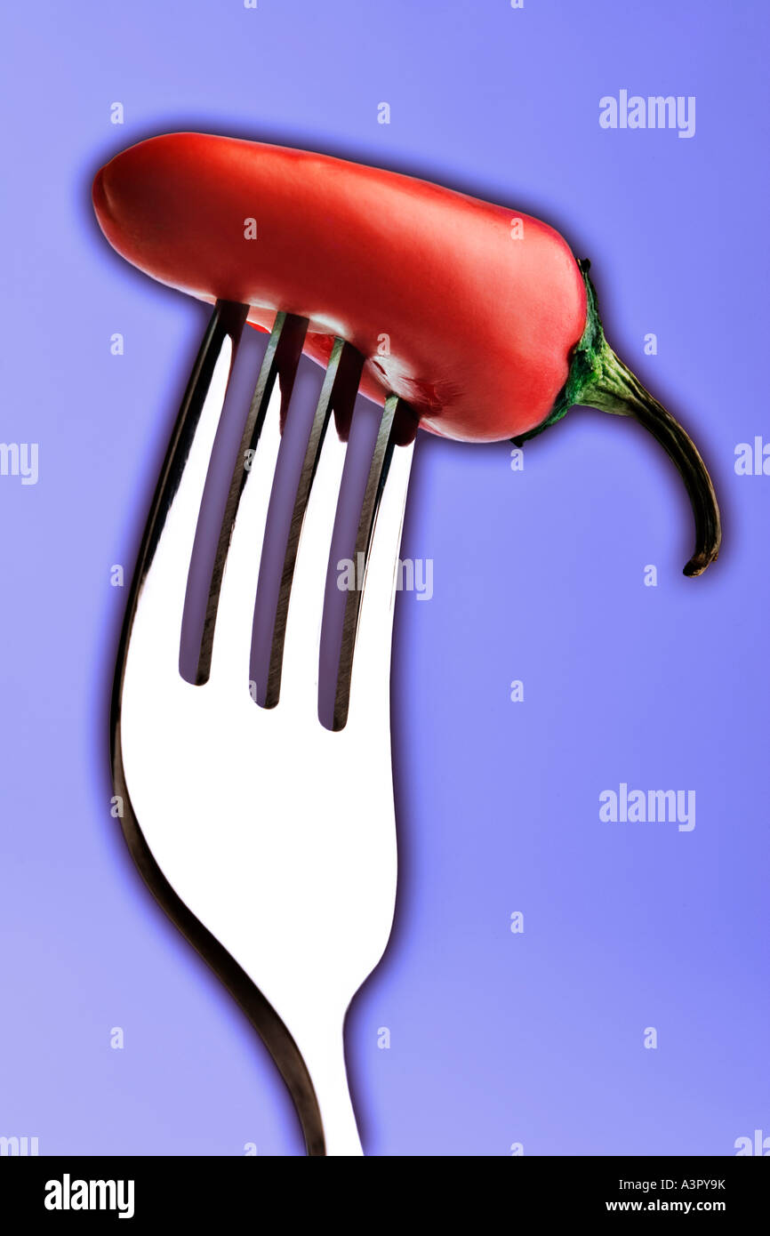 Pepper stuck by a fork Stock Photo - Alamy