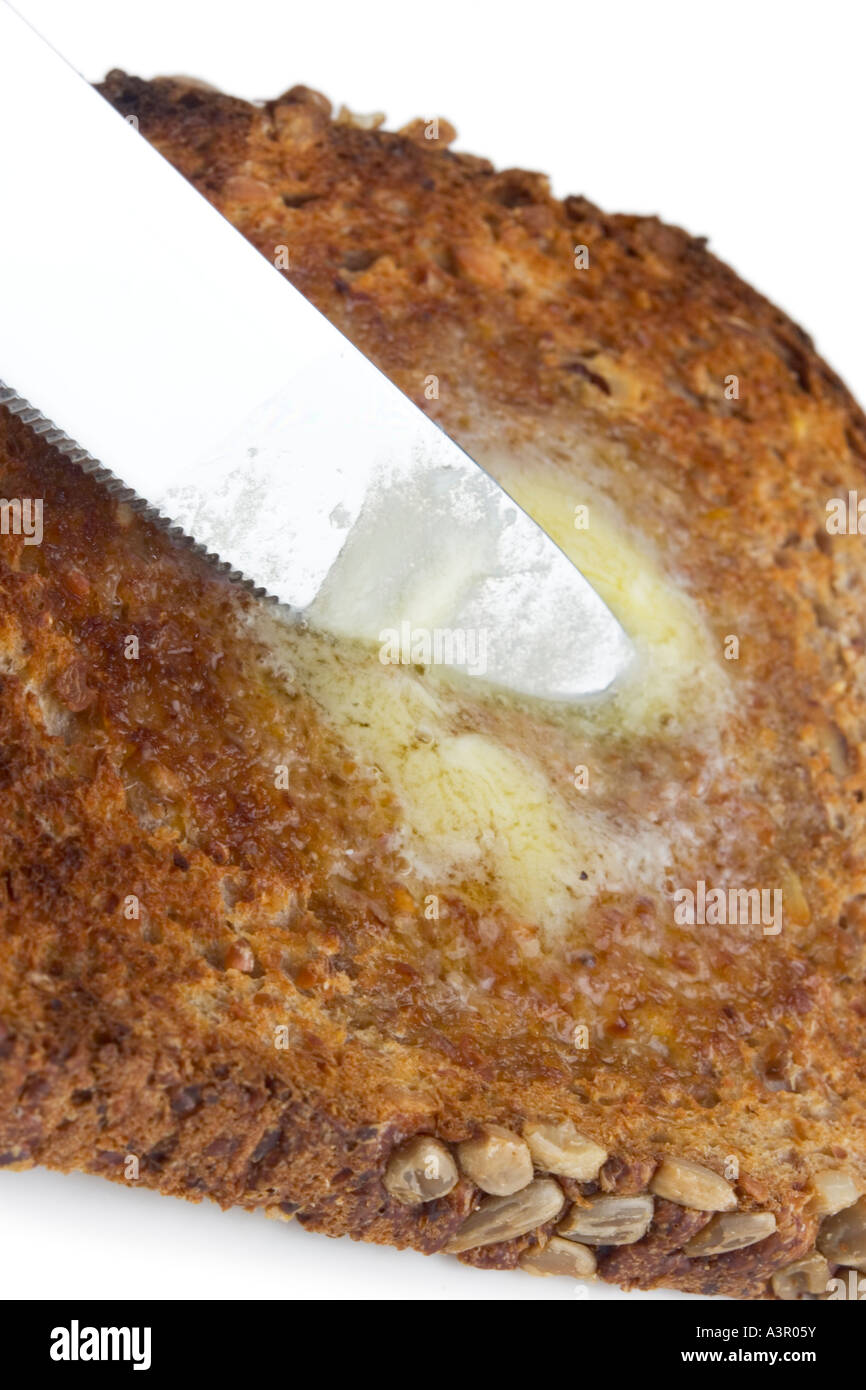 Spreading butter on toast Stock Photo - Alamy