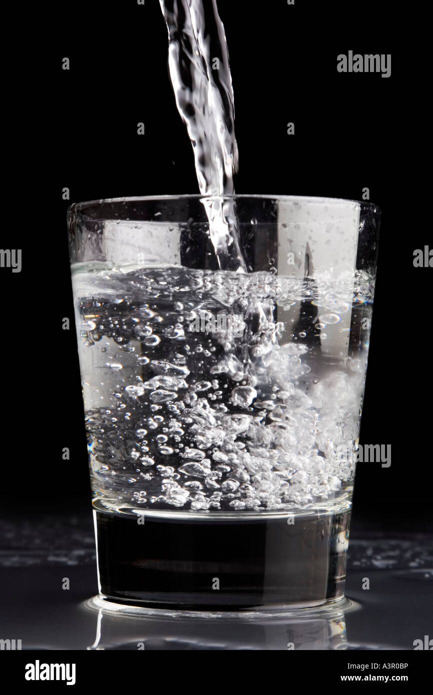 Pouring a glass of water Stock Photo - Alamy