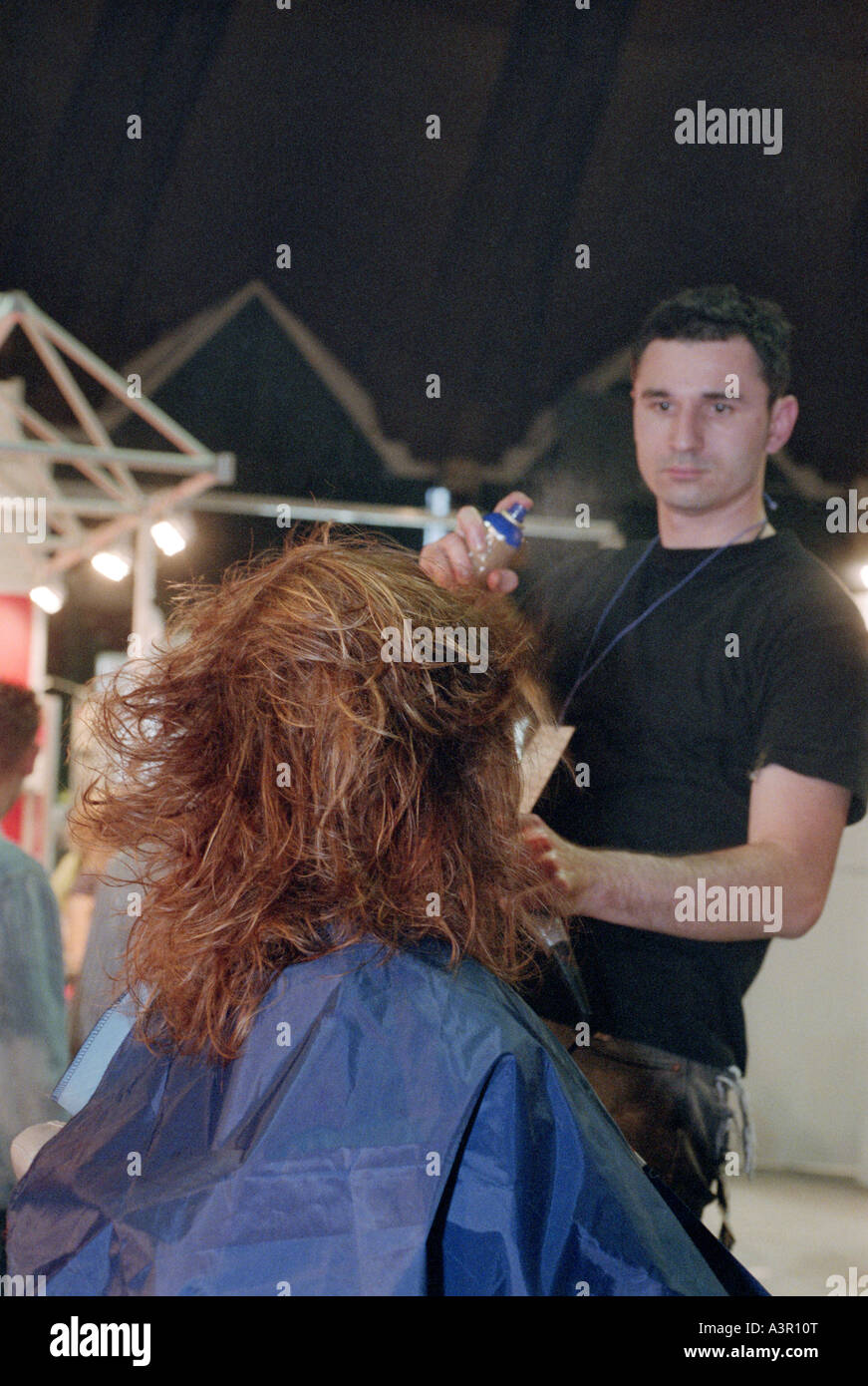 Professional hairdresser at the International Hair Fair 2005 in Poznan ...
