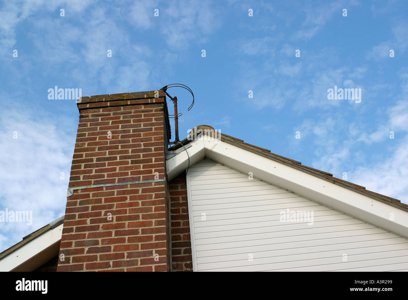 Apex roofline and chimney Stock Photo - Alamy