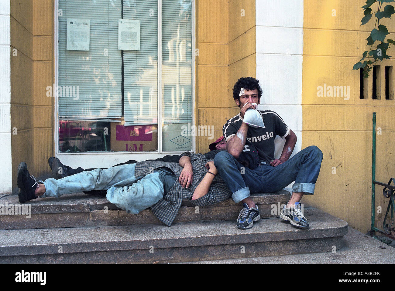 Men sniffing glue, Bucharest, Romania Stock Photo - Alamy