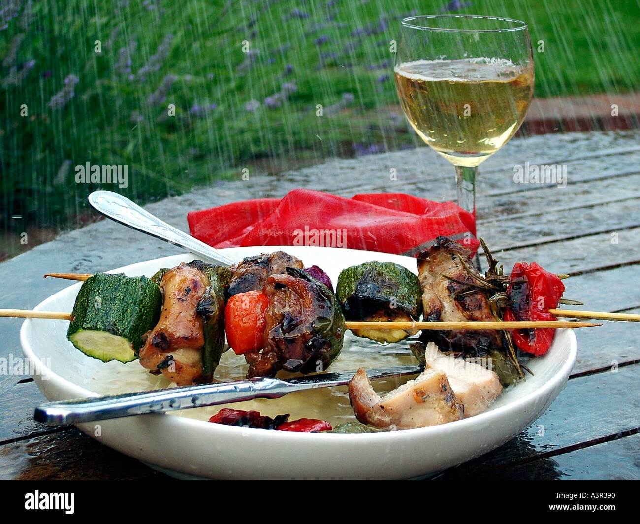 Barbeque food ruined by downpour Stock Photo - Alamy