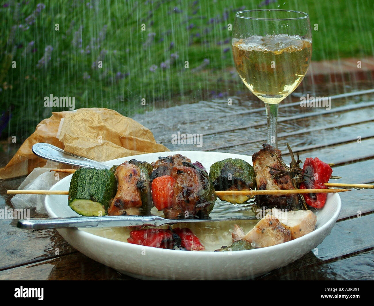 Barbeque food ruined by downpour Stock Photo - Alamy