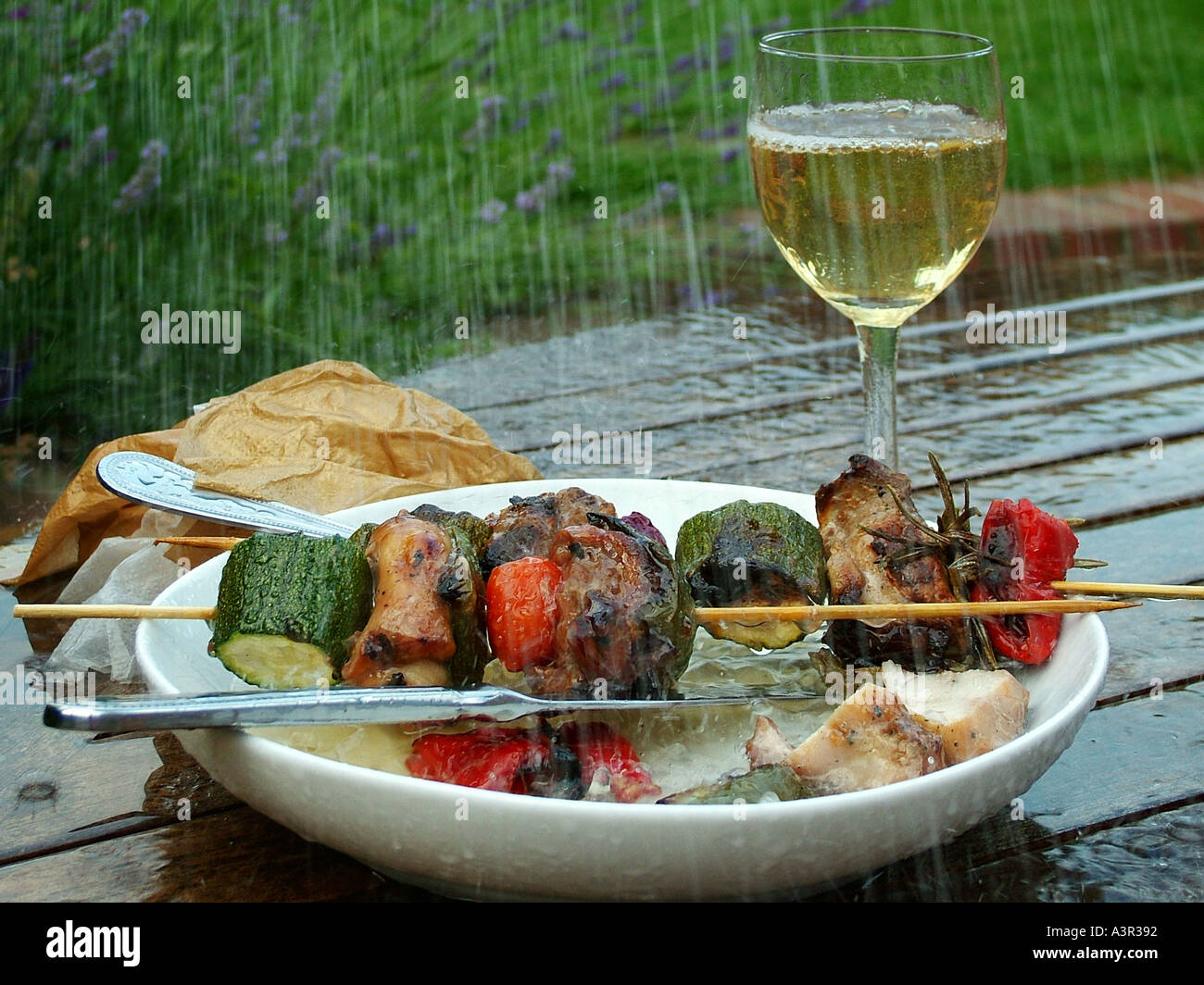 Barbeque food ruined by downpour Stock Photo - Alamy