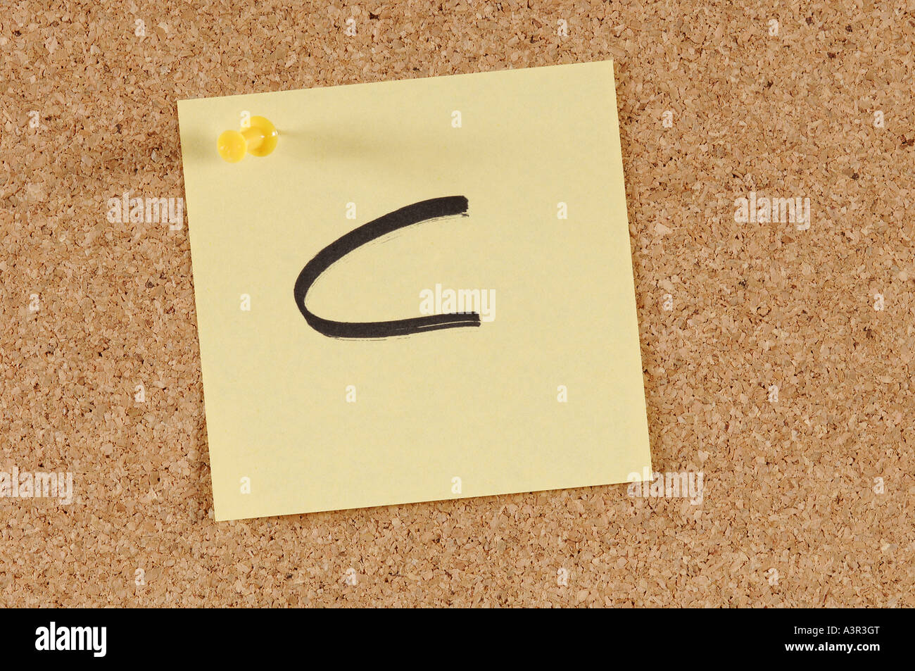Message cork board with alphabet letter Stock Photo - Alamy