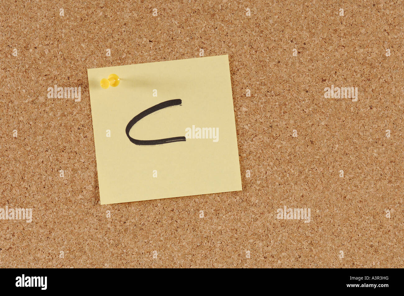 Message cork board with alphabet letter Stock Photo - Alamy