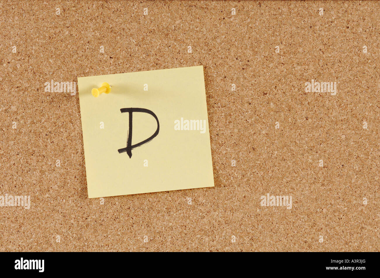 Message cork board with alphabet letter Stock Photo - Alamy