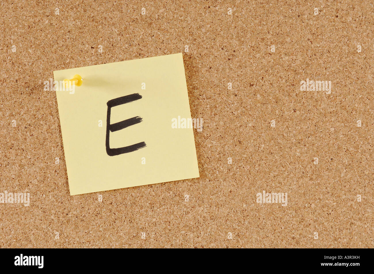 Message cork board with alphabet letter Stock Photo - Alamy