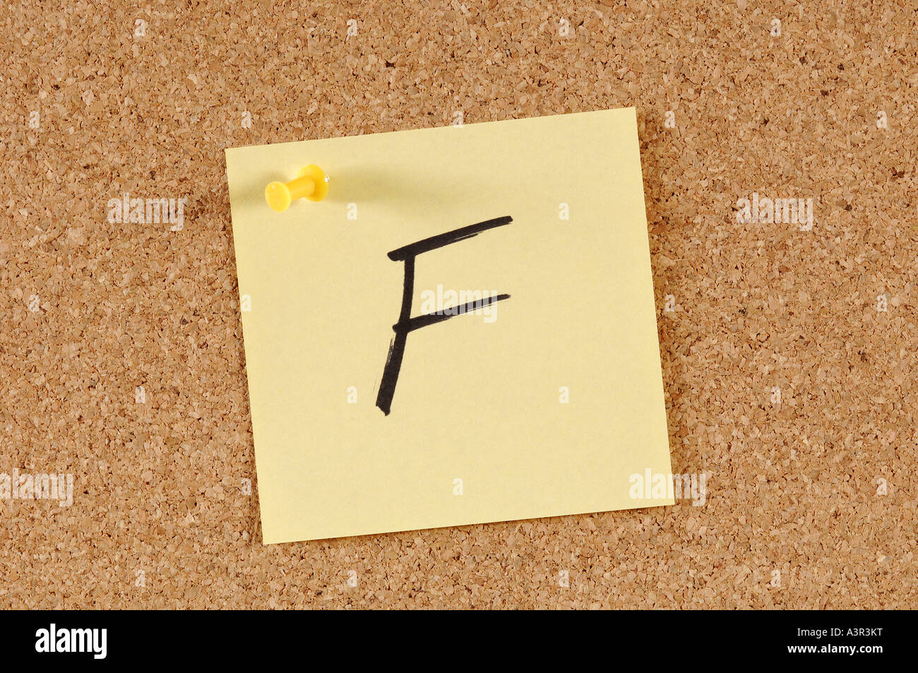Message cork board with alphabet letter Stock Photo - Alamy