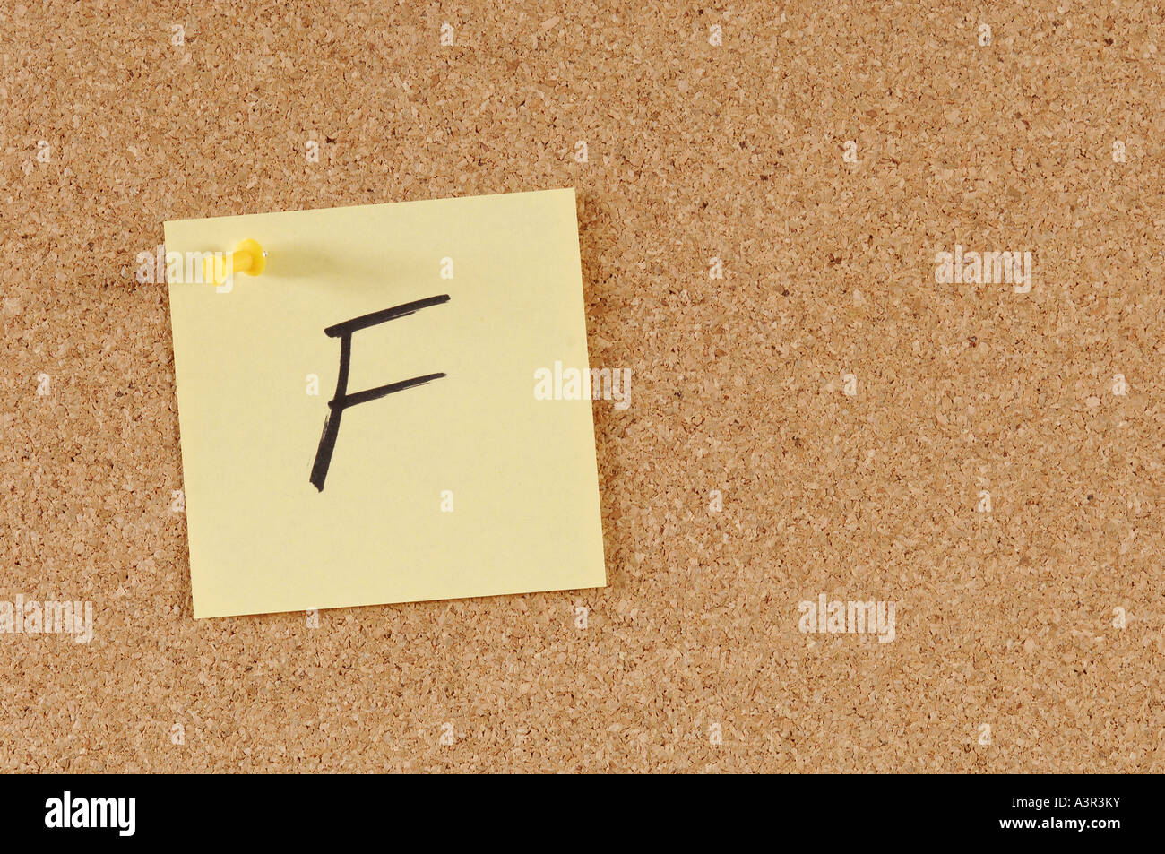 Message cork board with alphabet letter Stock Photo - Alamy