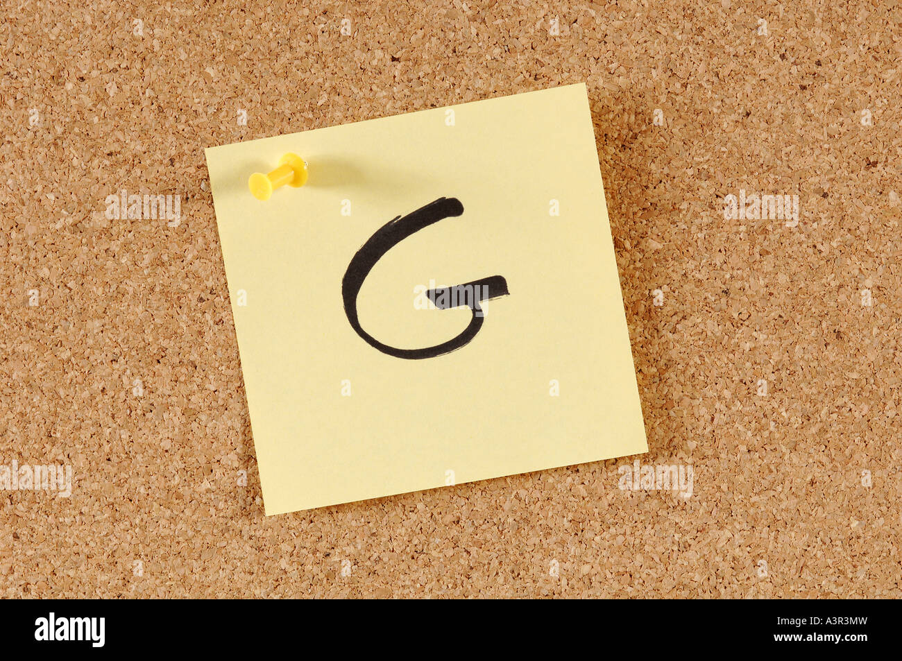 Message cork board with alphabet letter Stock Photo - Alamy