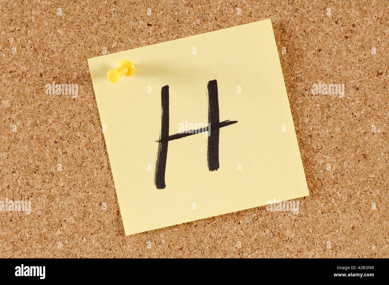 Message cork board with alphabet letter Stock Photo - Alamy