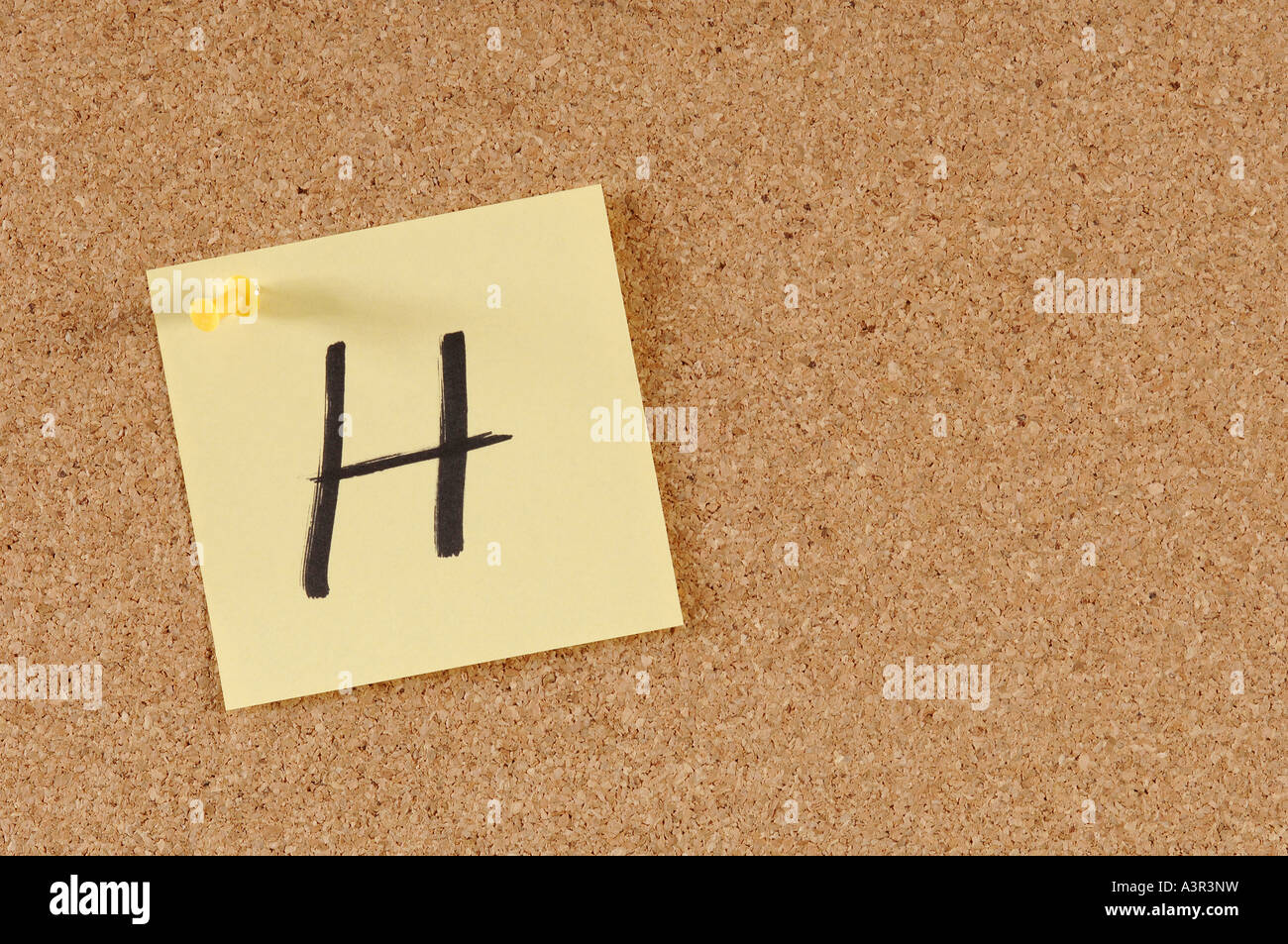 Message cork board with alphabet letter Stock Photo - Alamy