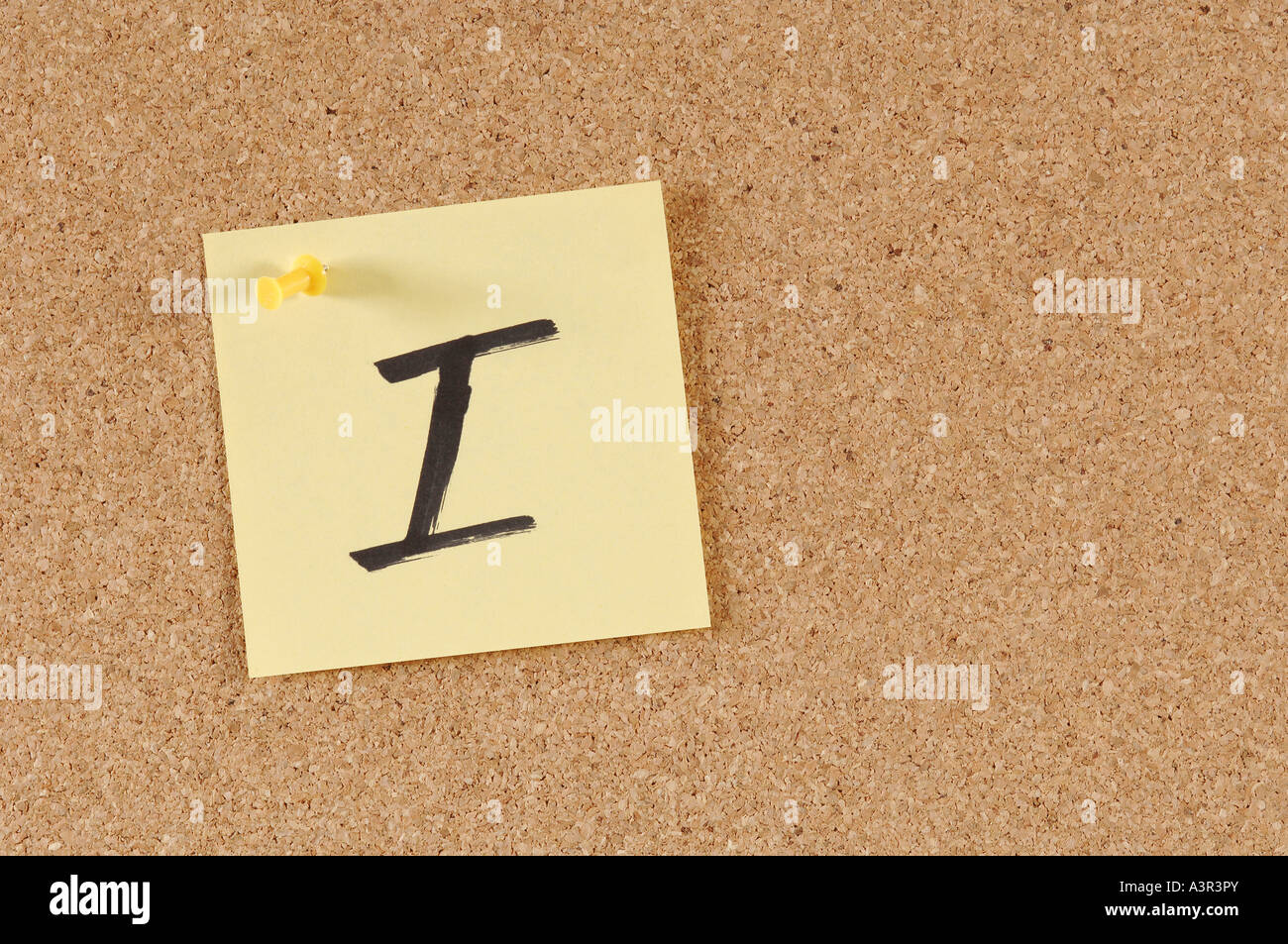Message cork board with alphabet letter Stock Photo - Alamy