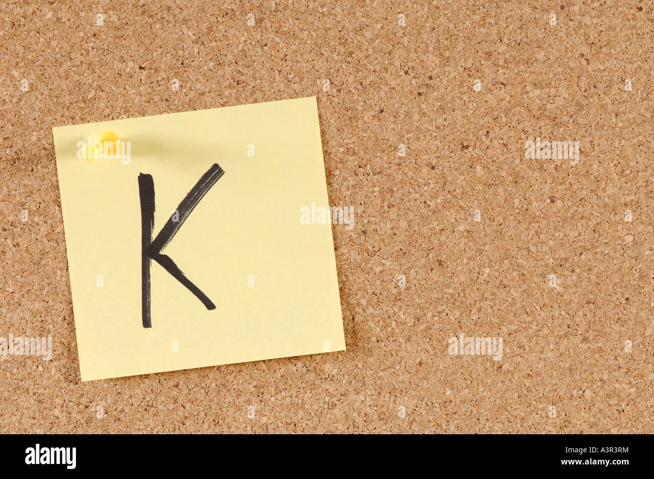 Message cork board with alphabet letter Stock Photo - Alamy