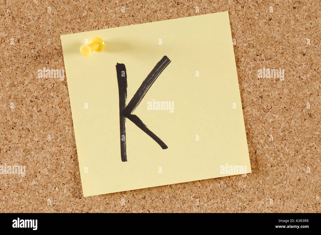 Message cork board with alphabet letter Stock Photo - Alamy