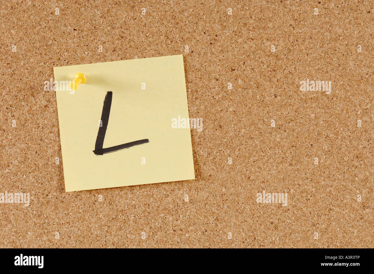 Message cork board with alphabet letters Stock Photo - Alamy