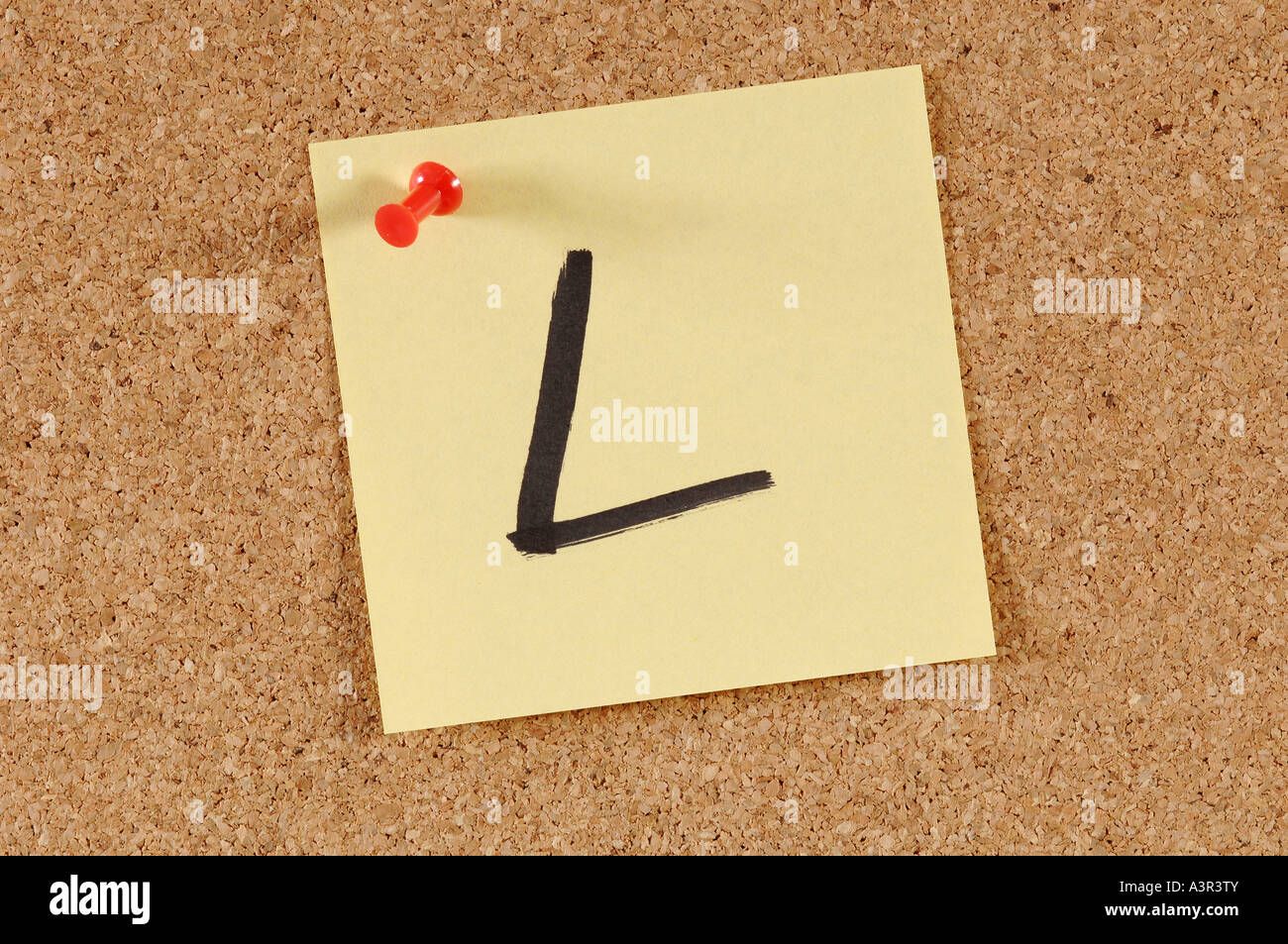 Message cork board with alphabet letters Stock Photo - Alamy