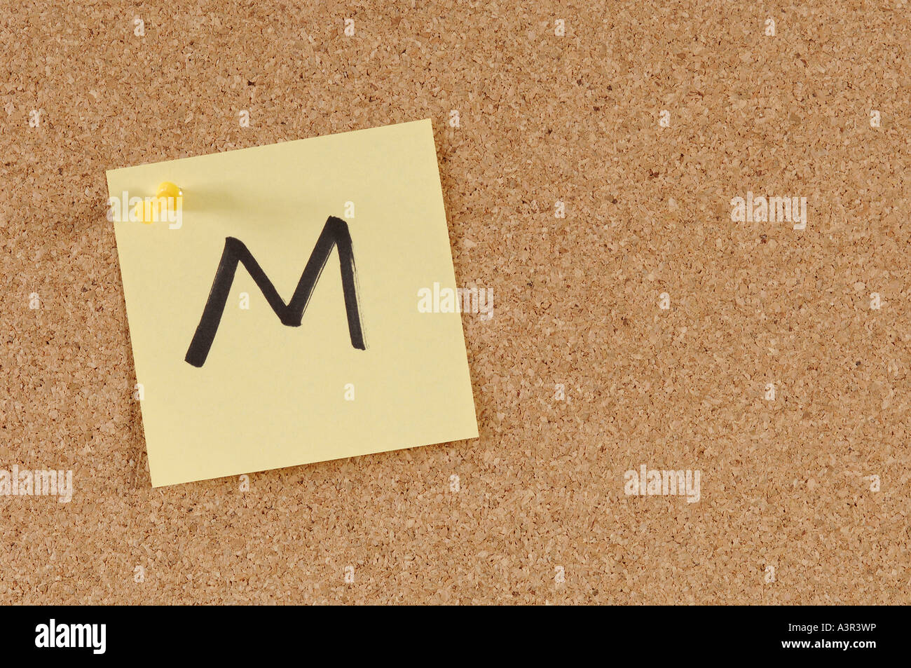 Message cork board with alphabet letters Stock Photo - Alamy