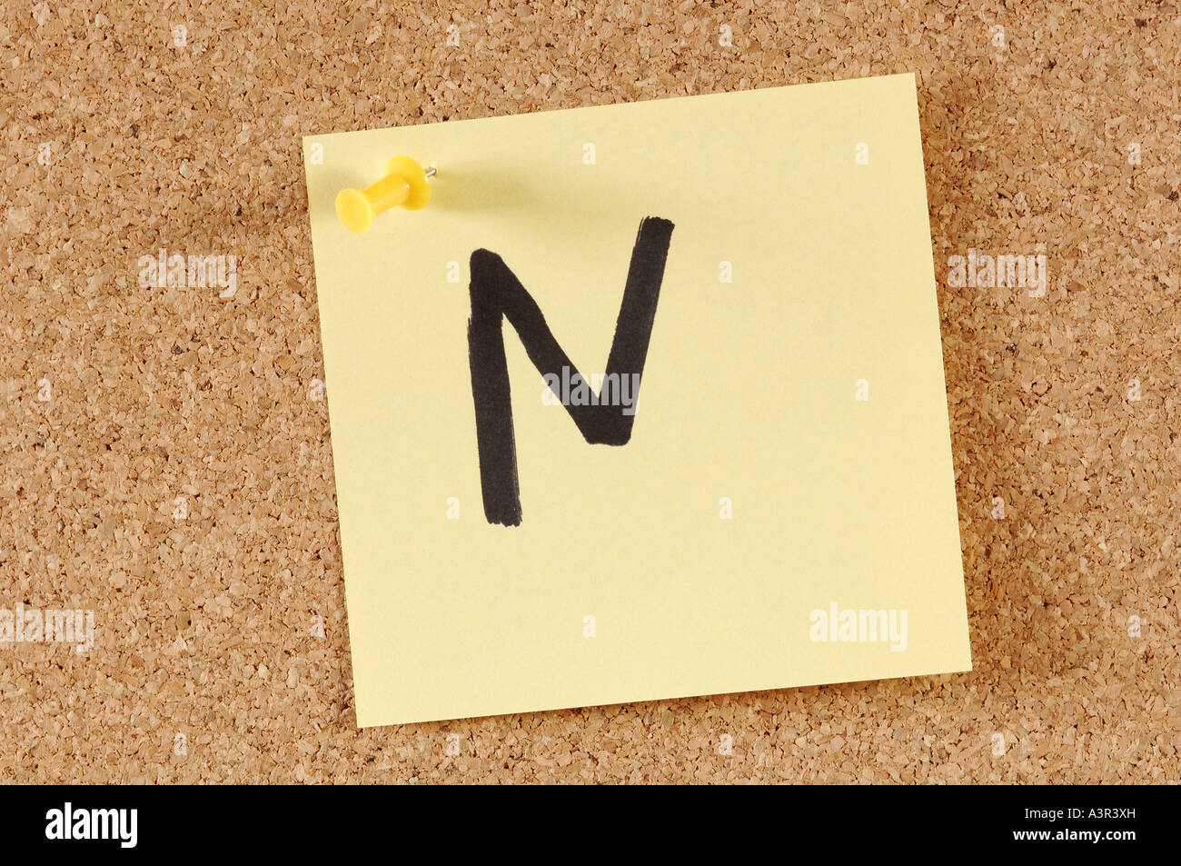Message cork board with alphabet letters Stock Photo - Alamy
