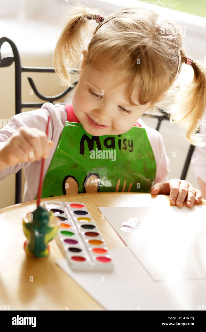 Portrait of young child colouring Stock Photo - Alamy
