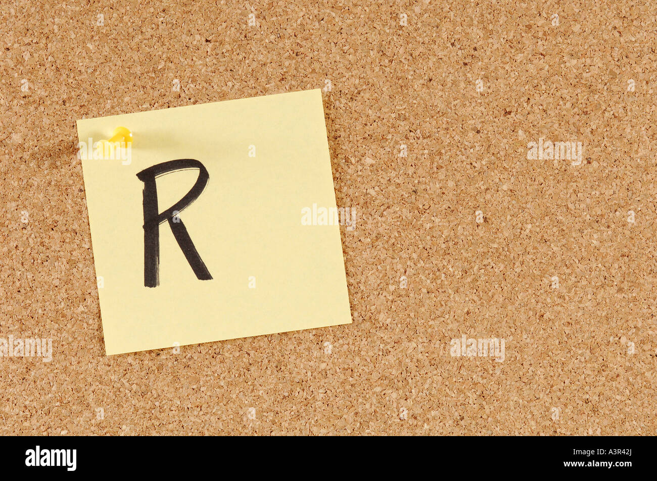 Message cork board with alphabet letters Stock Photo - Alamy