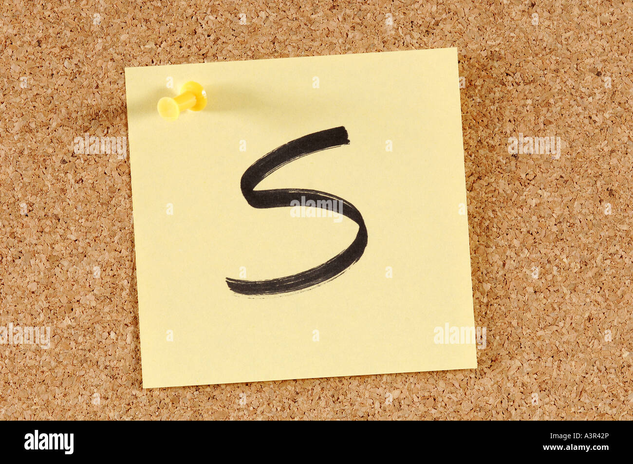 Message cork board with alphabet letters Stock Photo - Alamy