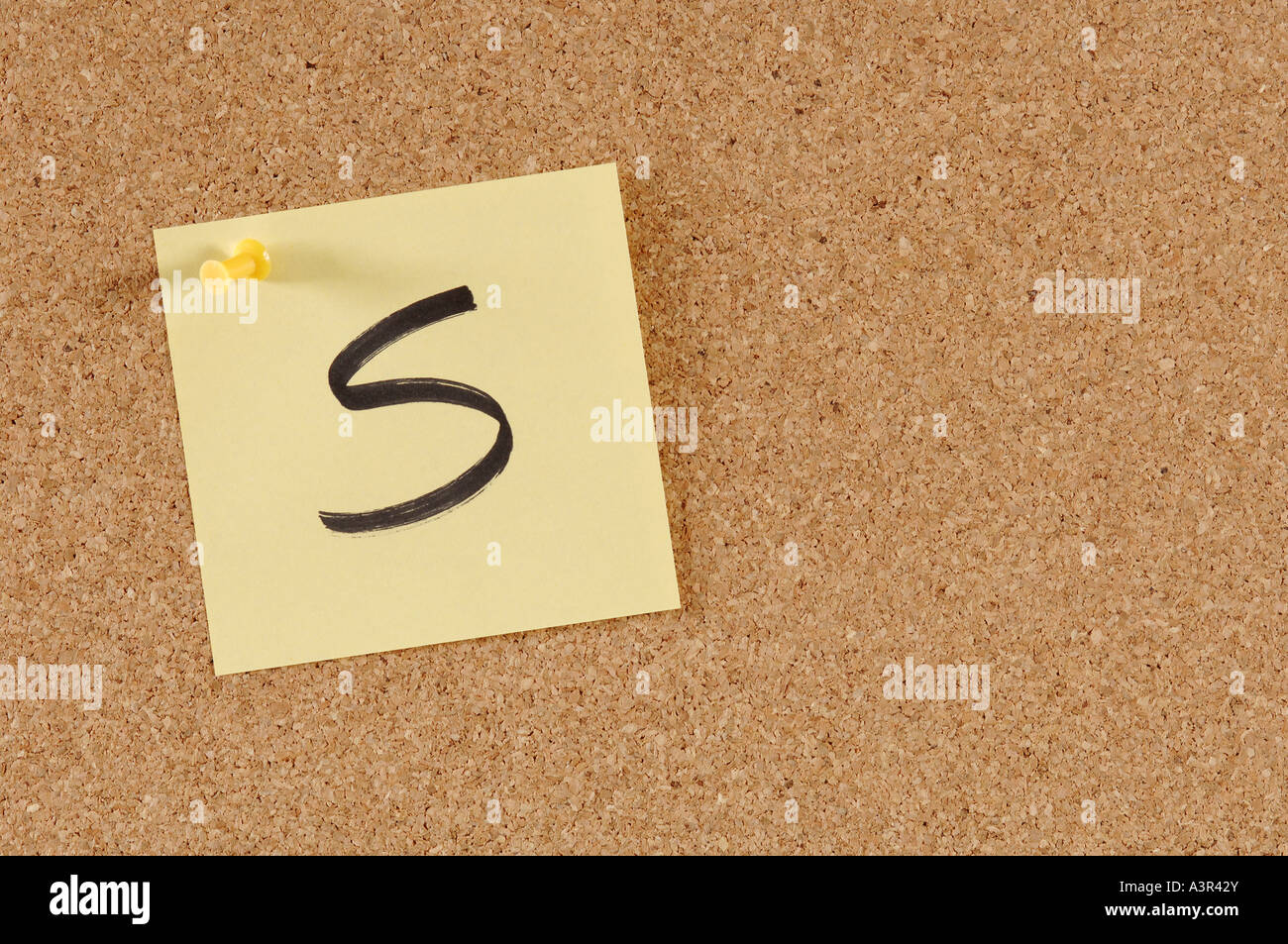 Message cork board with alphabet letters Stock Photo - Alamy