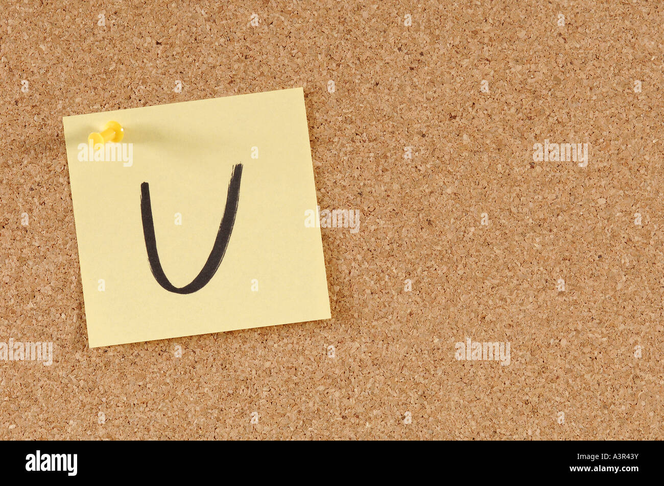 Message cork board with alphabet letters Stock Photo - Alamy