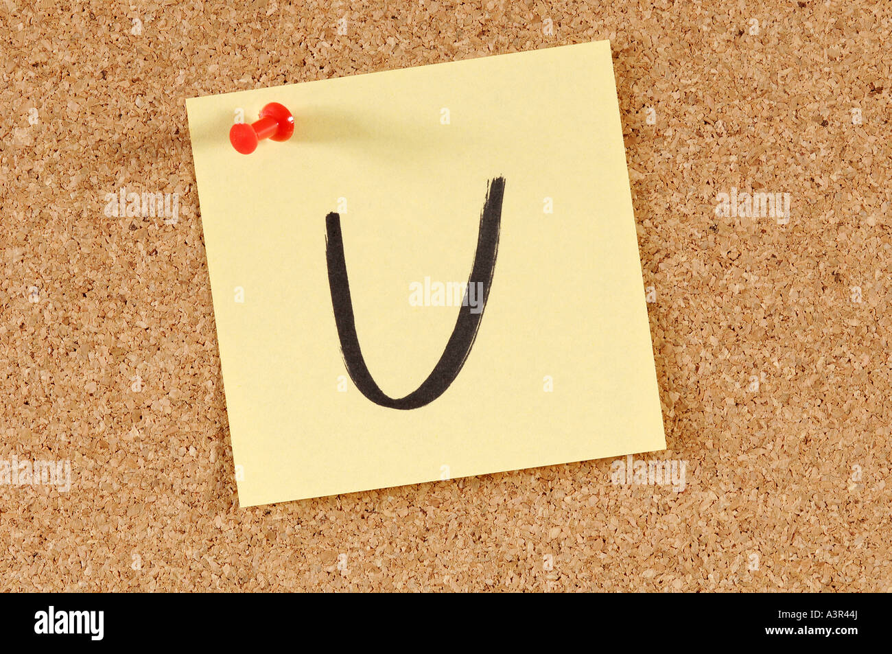 Message cork board with alphabet letters Stock Photo - Alamy