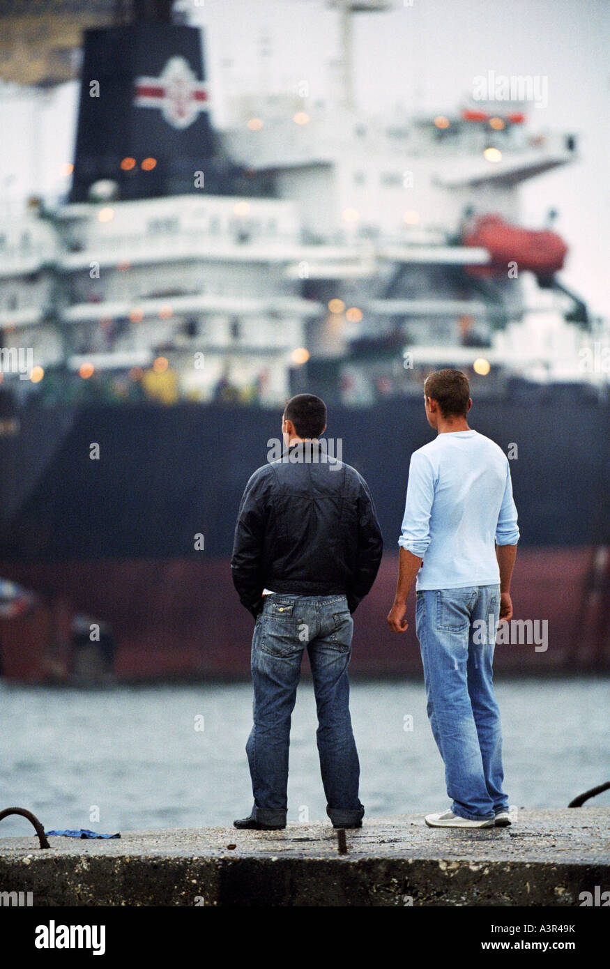 Two young men at the Daewoo dockyard in Mangalia, Romania Stock Photo ...